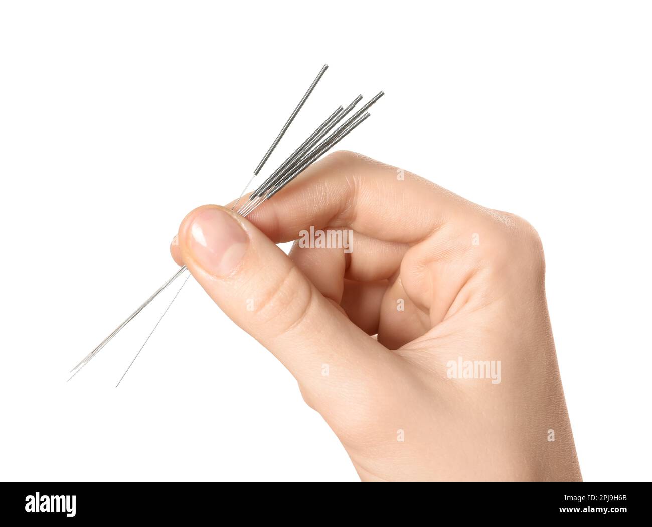 Doctor holding acupuncture needles Cut Out Stock Images & Pictures - Alamy