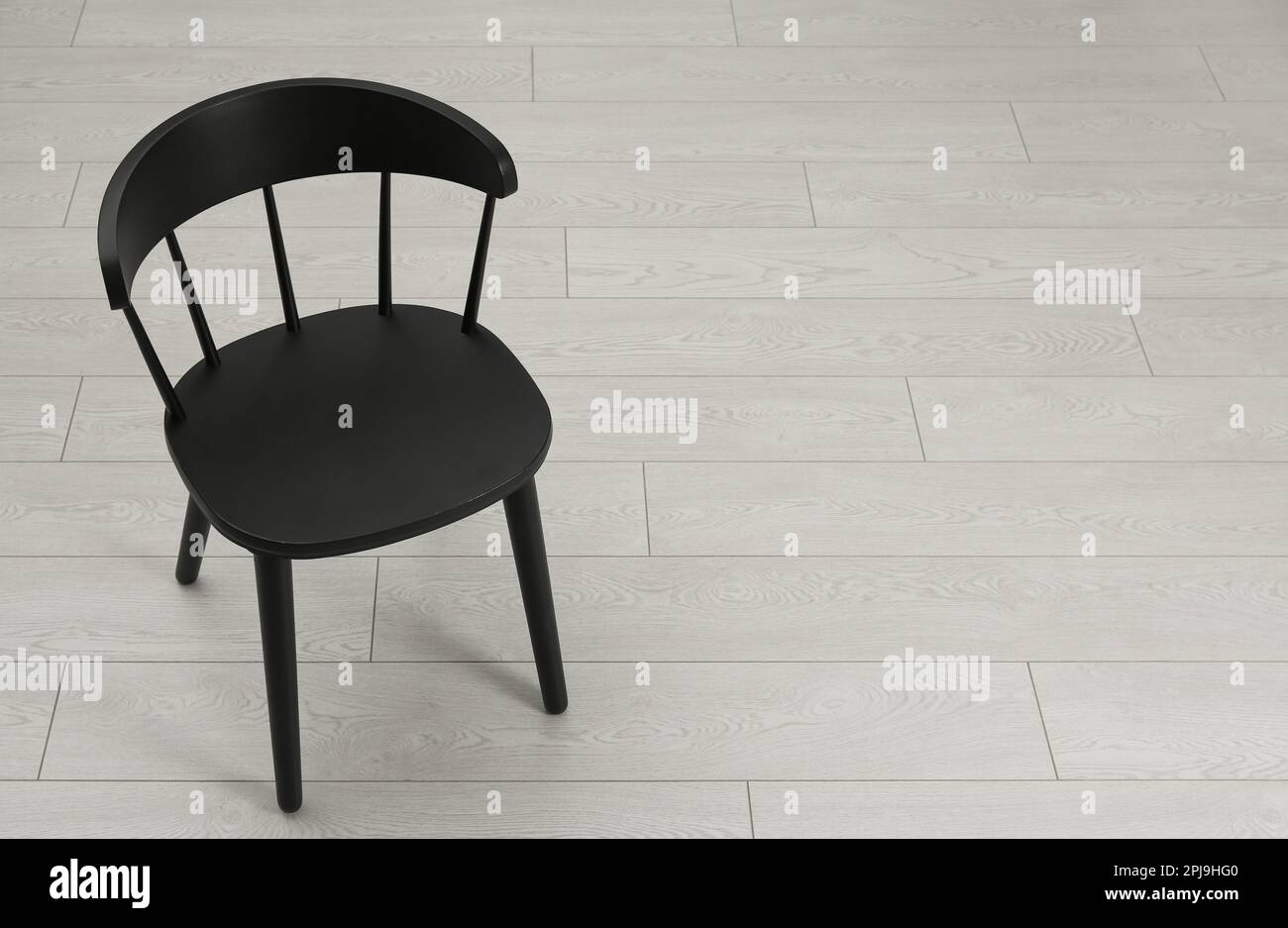 Stylish wooden chair on floor. Space for text Stock Photo - Alamy