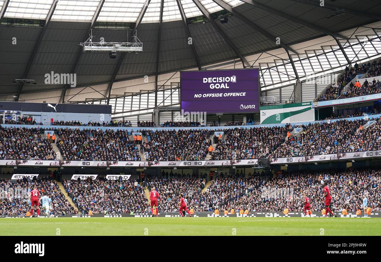 A big screen displays the VAR decision to award Liverpool's Mohamed ...
