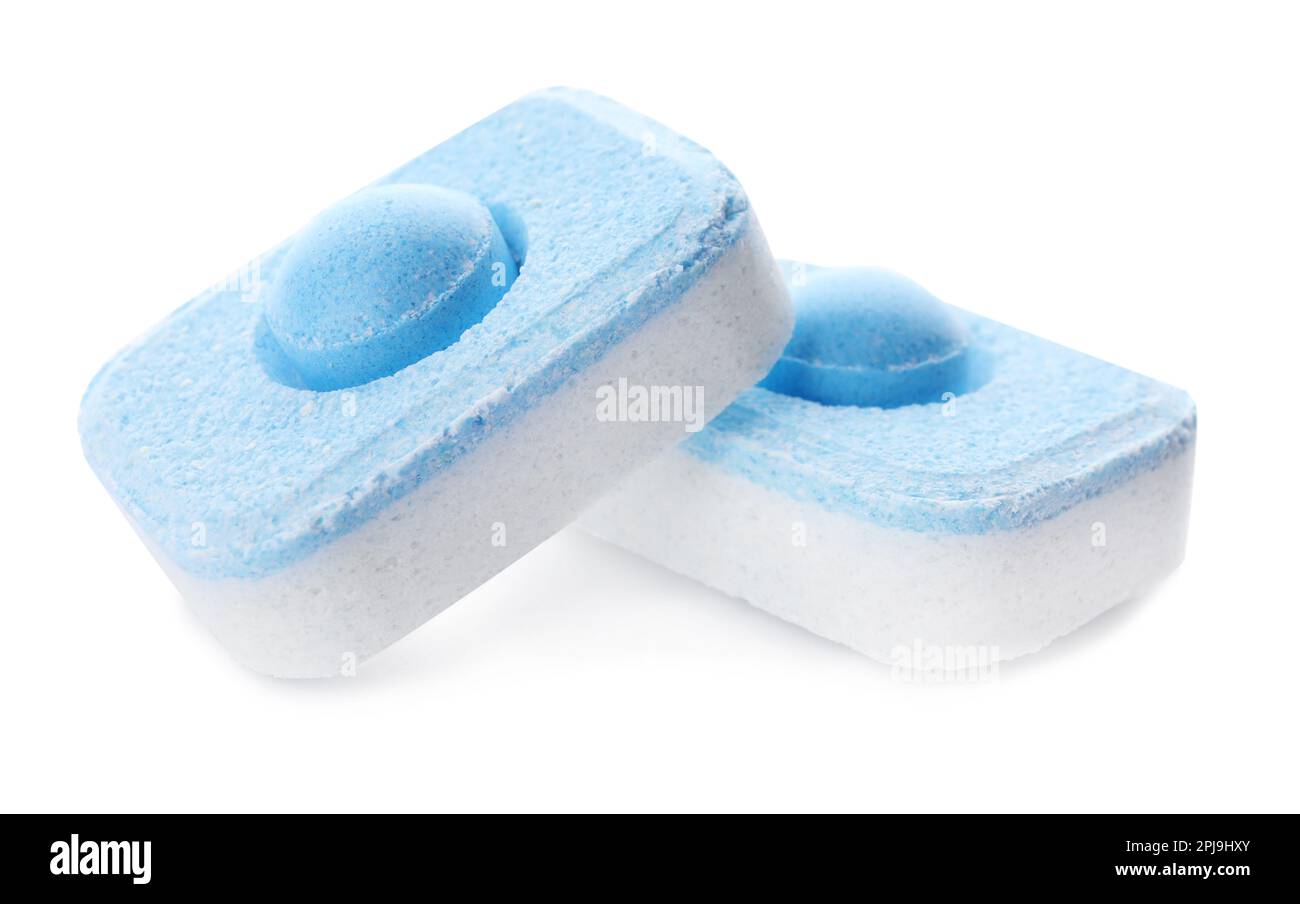 Two water softener tablets isolated on white Stock Photo - Alamy