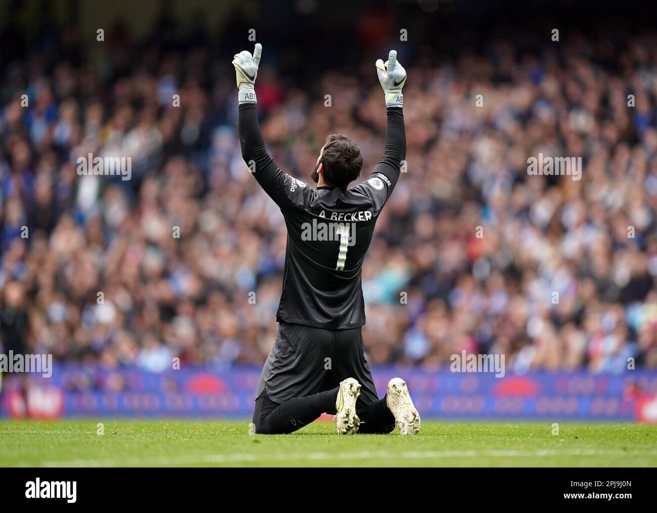 Liverpool goalkeeper Alisson Becker celebrates after team-mate Mohamed ...