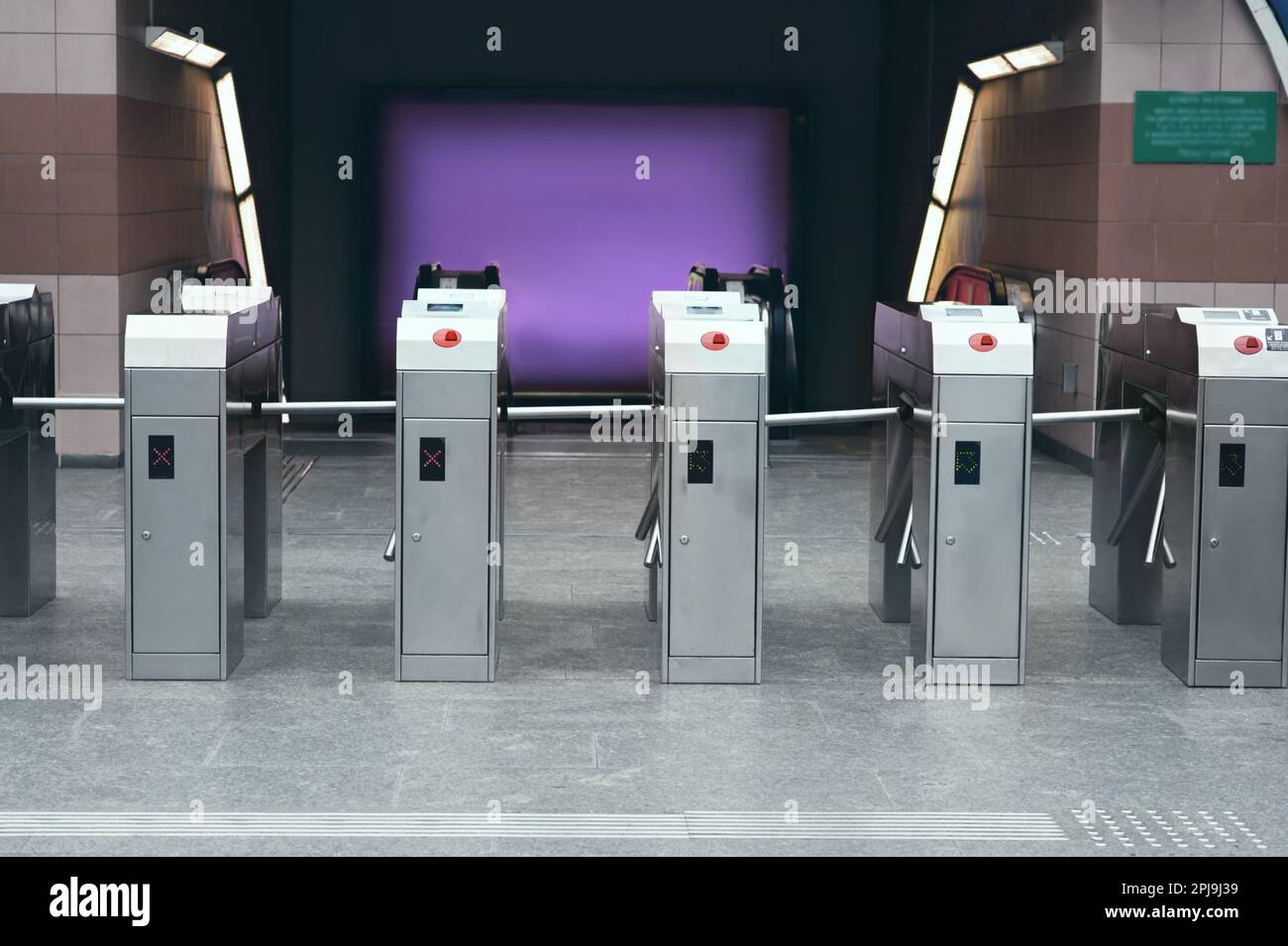 Many modern turnstiles outdoors. Fare collection system Stock Photo - Alamy