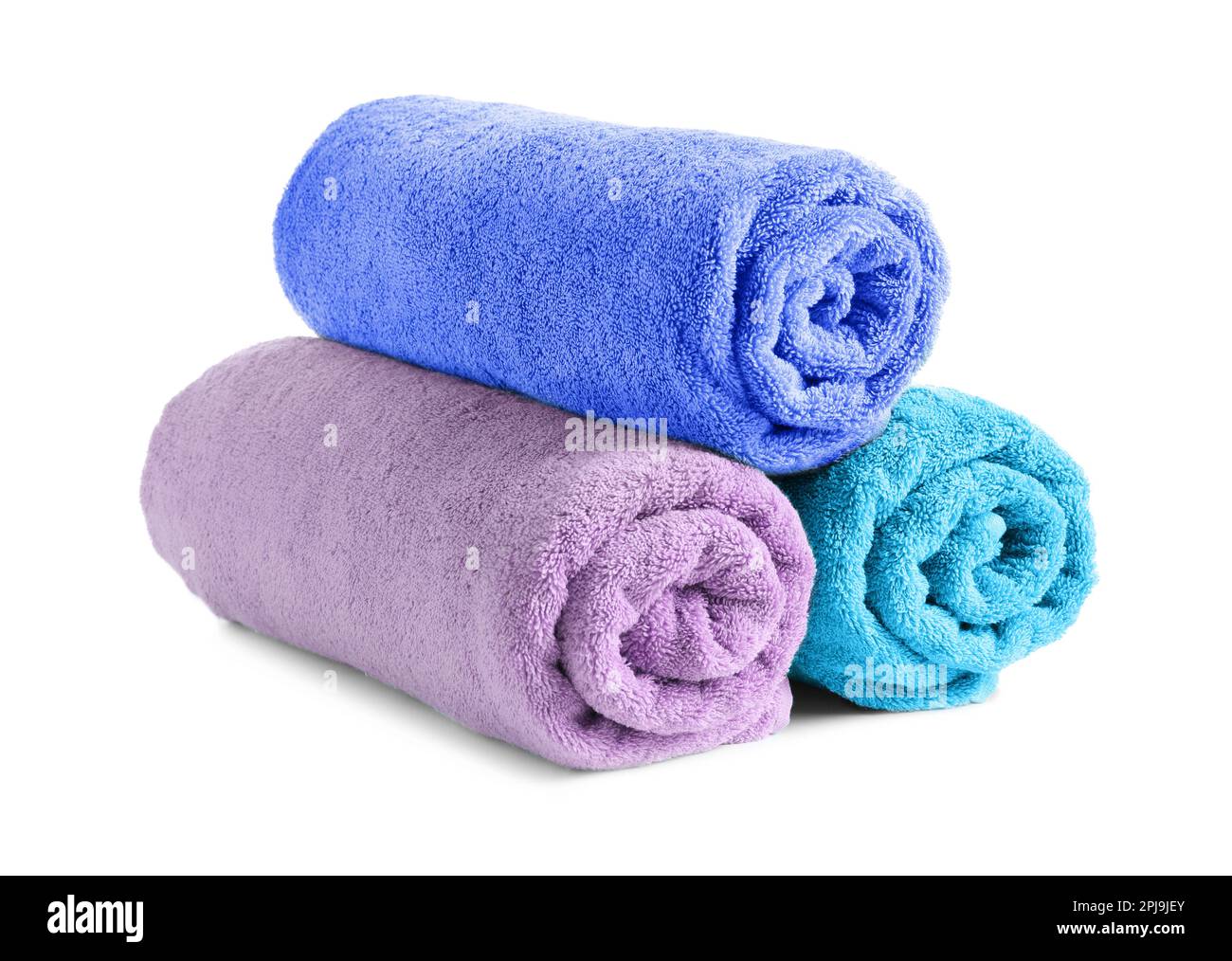 Rolled soft terry towels on white background Stock Photo - Alamy