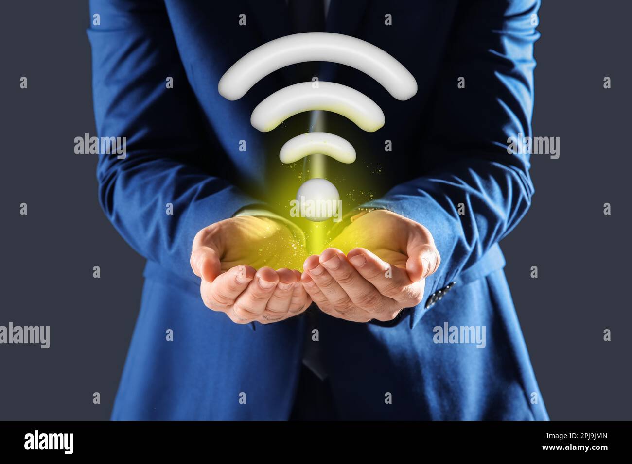 Man holding Wi Fi symbol in hands on dark grey background, closeup ...