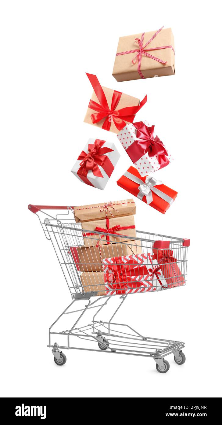 Beautifully wrapped gift boxes falling into metal shopping cart on ...
