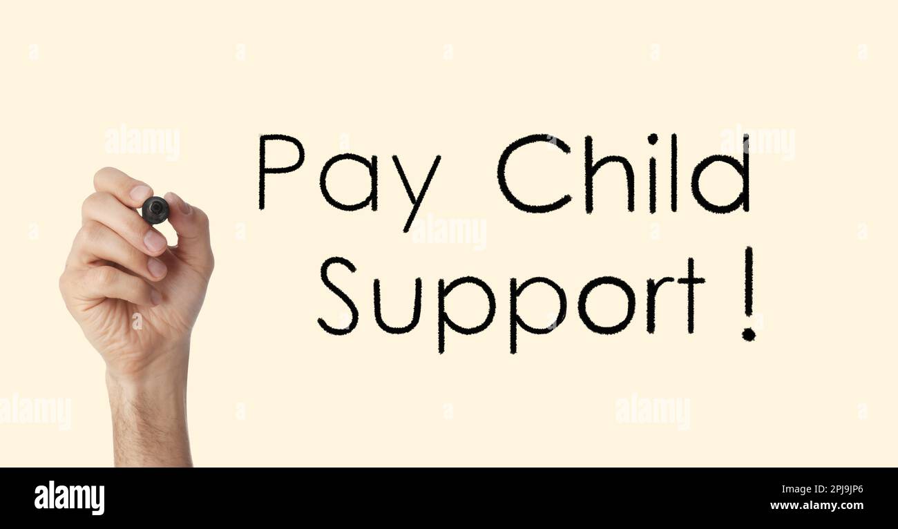 Man with marker and phrase PAY CHILD SUPPORT! on beige background ...