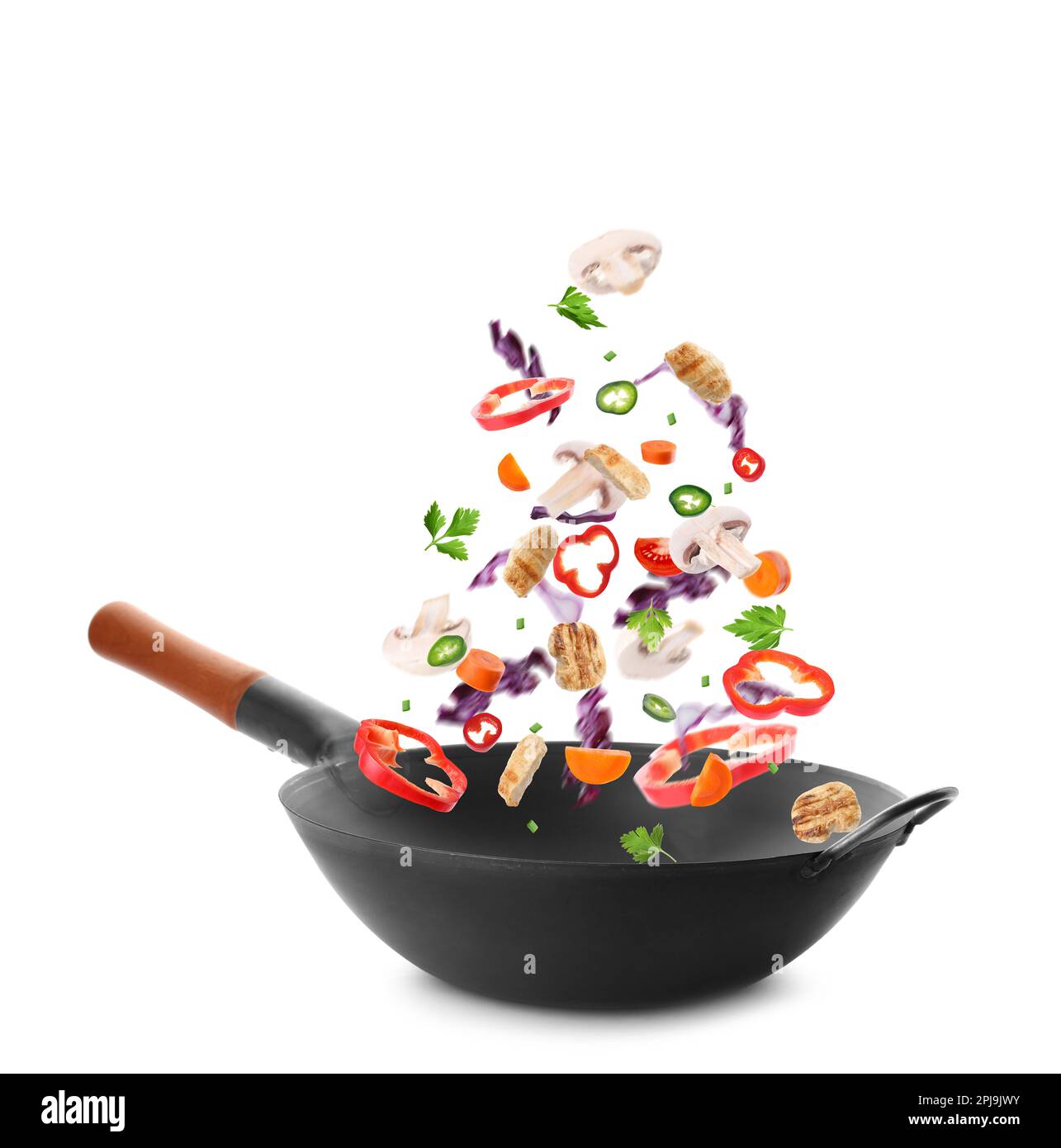 Different tasty ingredients falling into wok on white background Stock ...