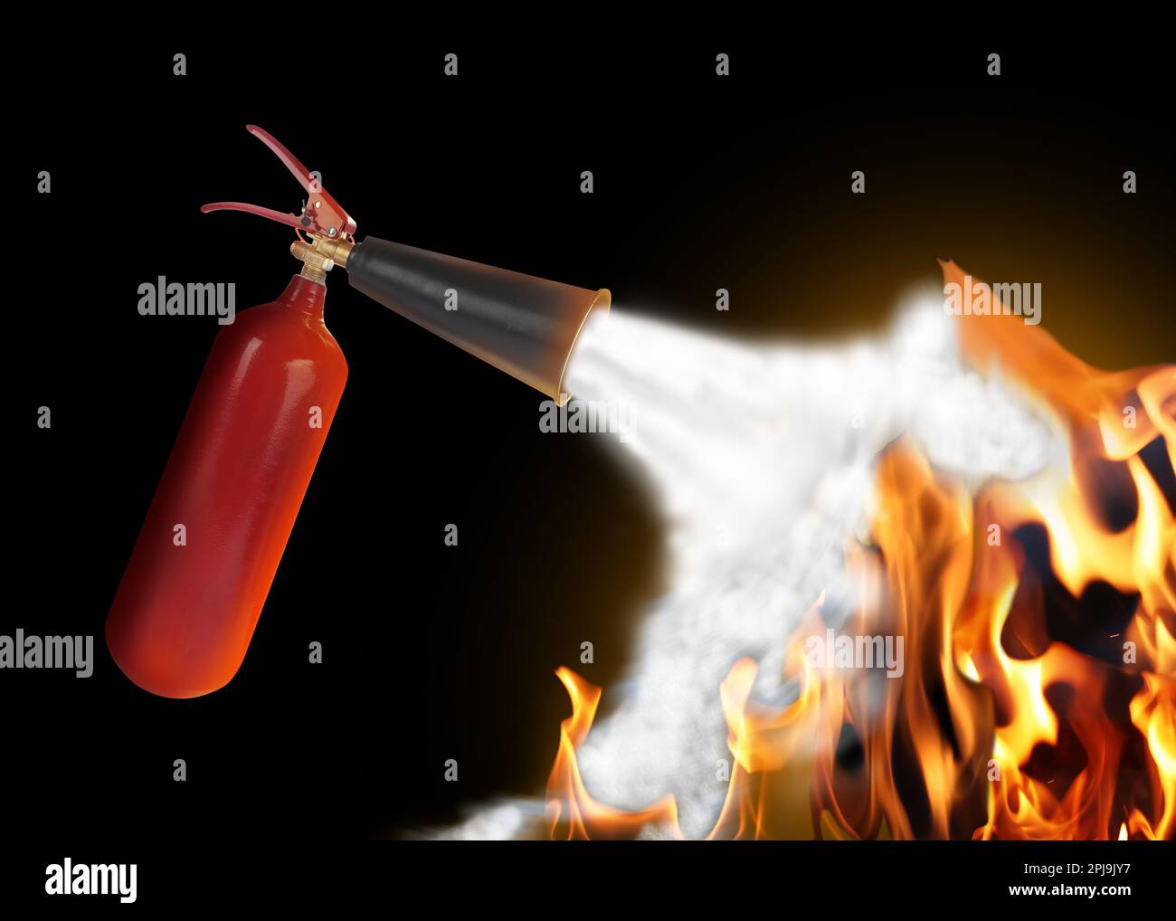 Putting out flame with fire extinguisher on dark background Stock Photo ...