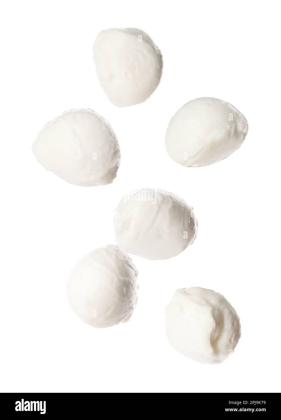 Mozzarella cheese balls falling on white background Stock Photo - Alamy