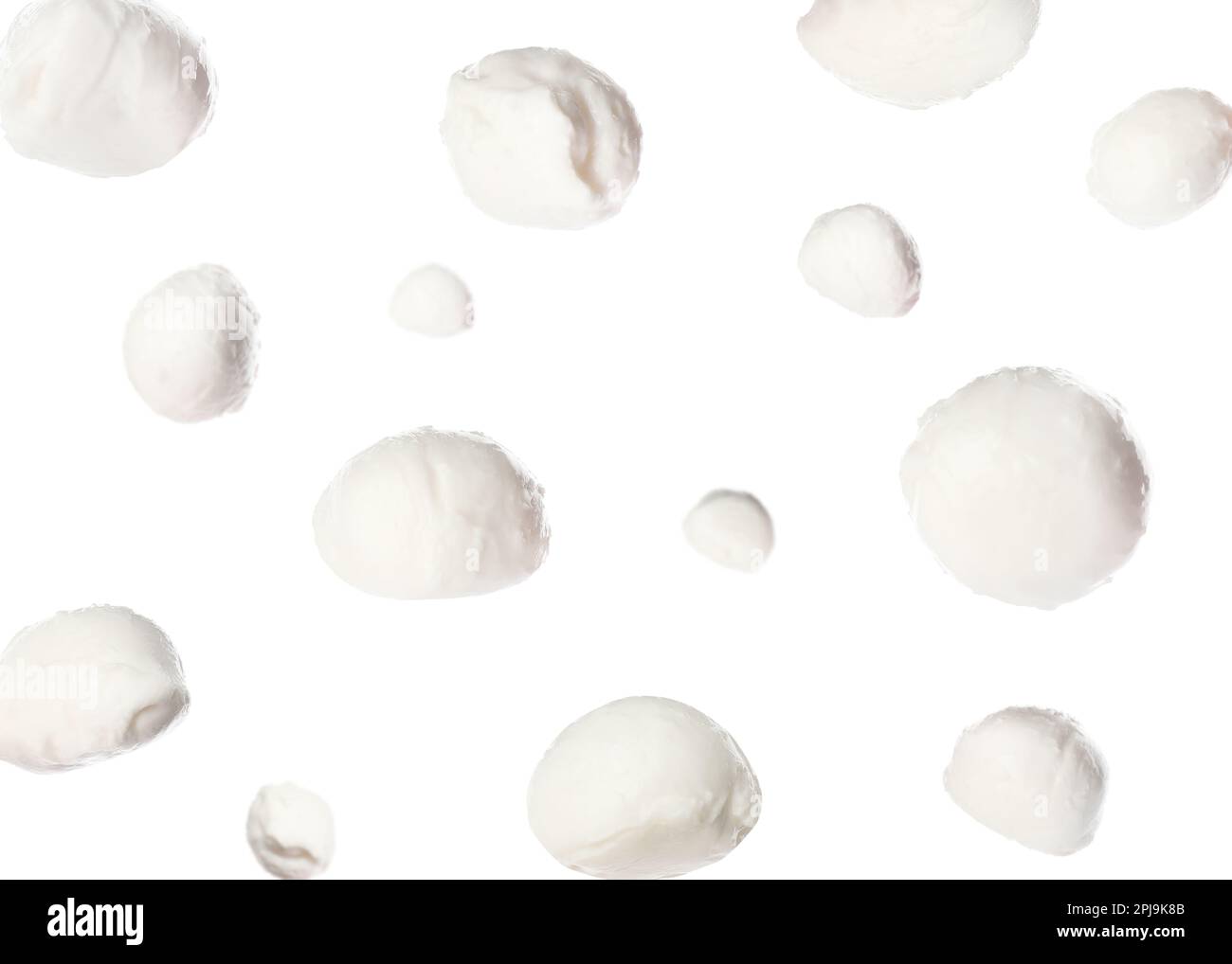 Mozzarella cheese balls falling on white background Stock Photo - Alamy
