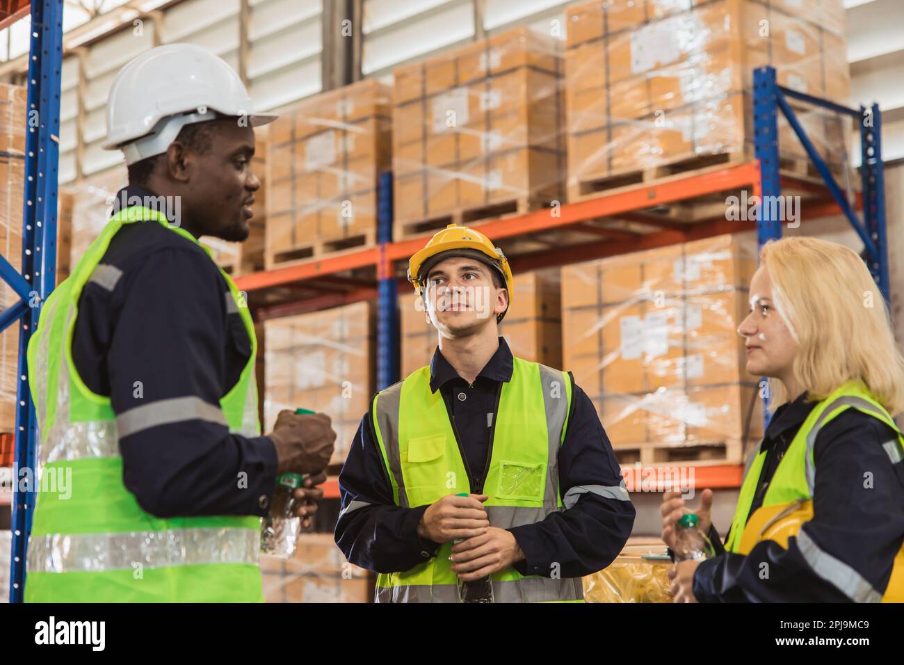 Staff worker friends relax enjoy talking together work in warehouse ...
