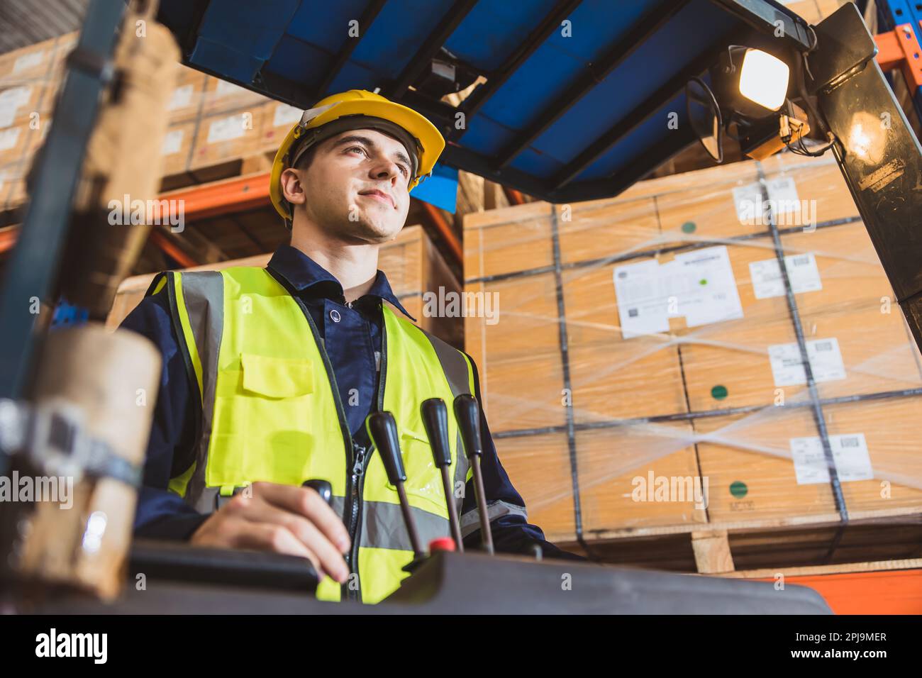 Caucasian male worker working in warehouse goods store. inventory staff ...