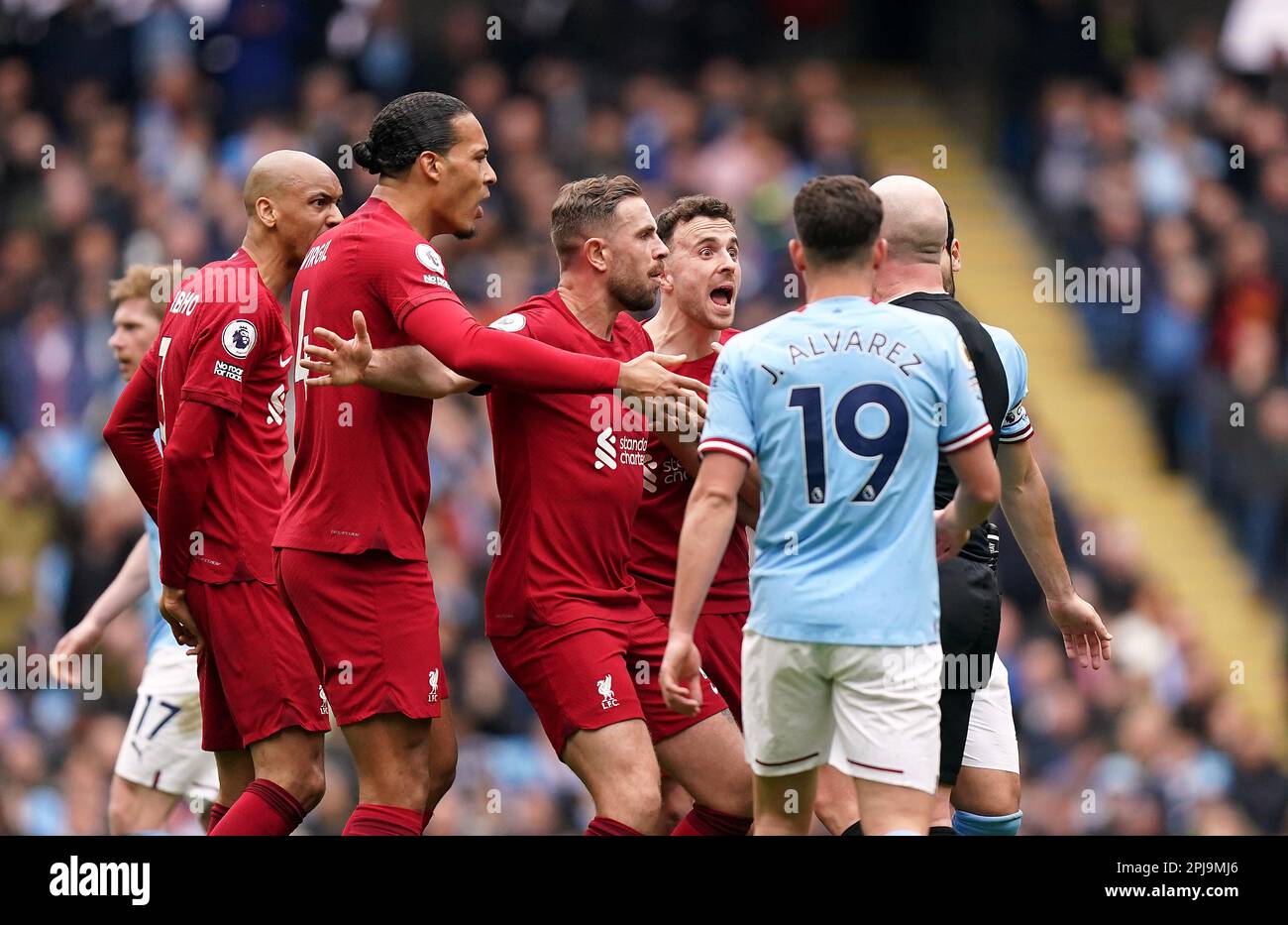 Players surround referee Simon Hooper as tempers flare during the ...