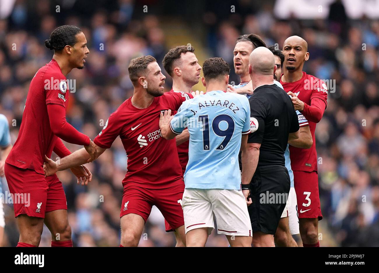 Players surround referee Simon Hooper as tempers flare during the ...