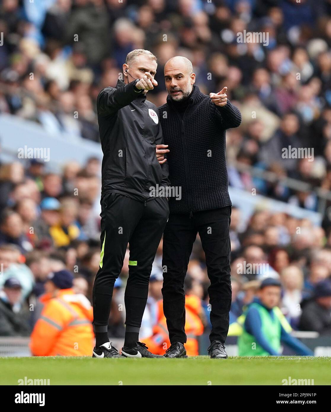 Manchester City manager Pep Guardiola speaks to the fourth official ...