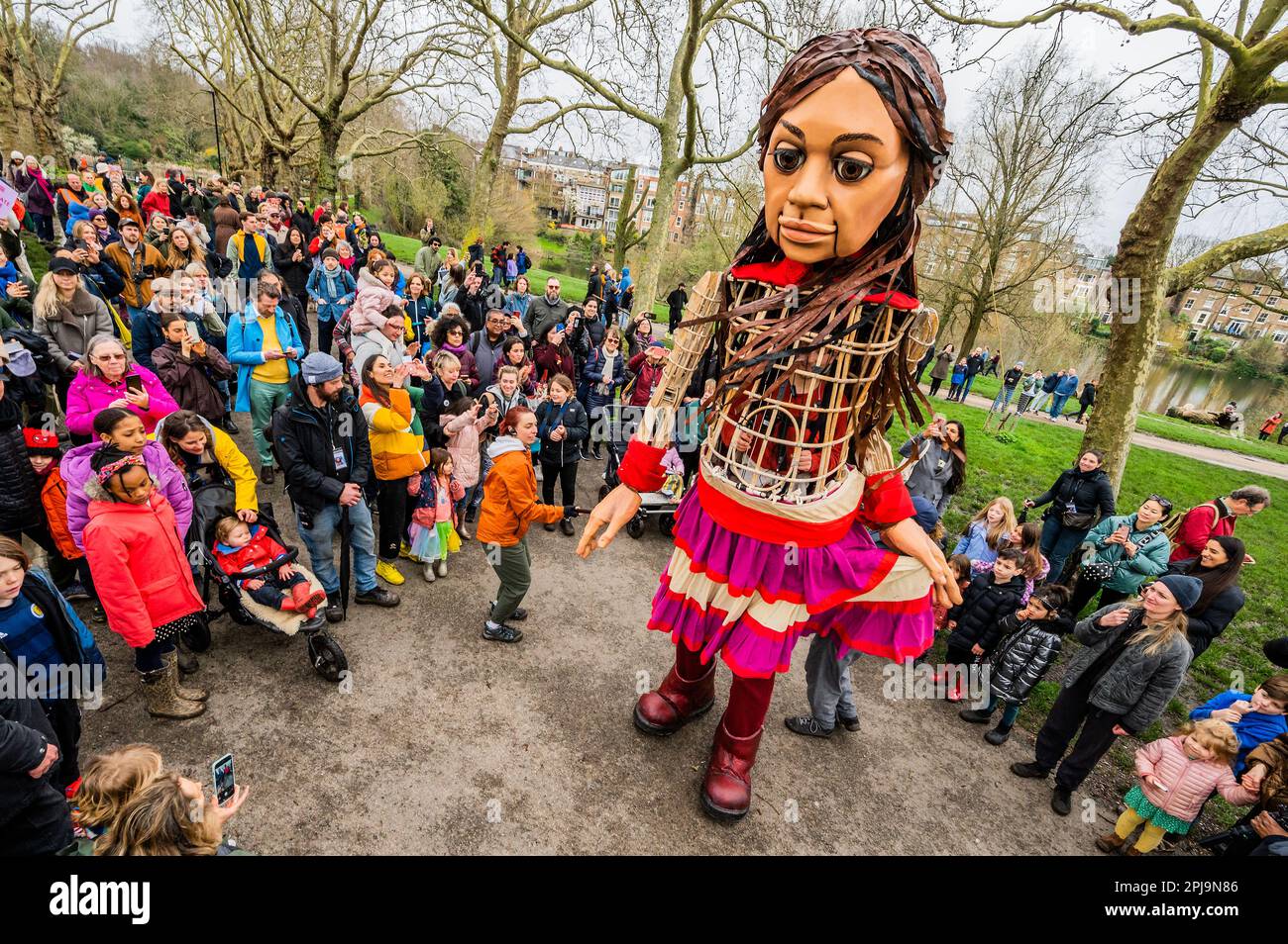 London, UK. 1st Apr, 2023. Little Amal leads a Sponsored Walk through ...