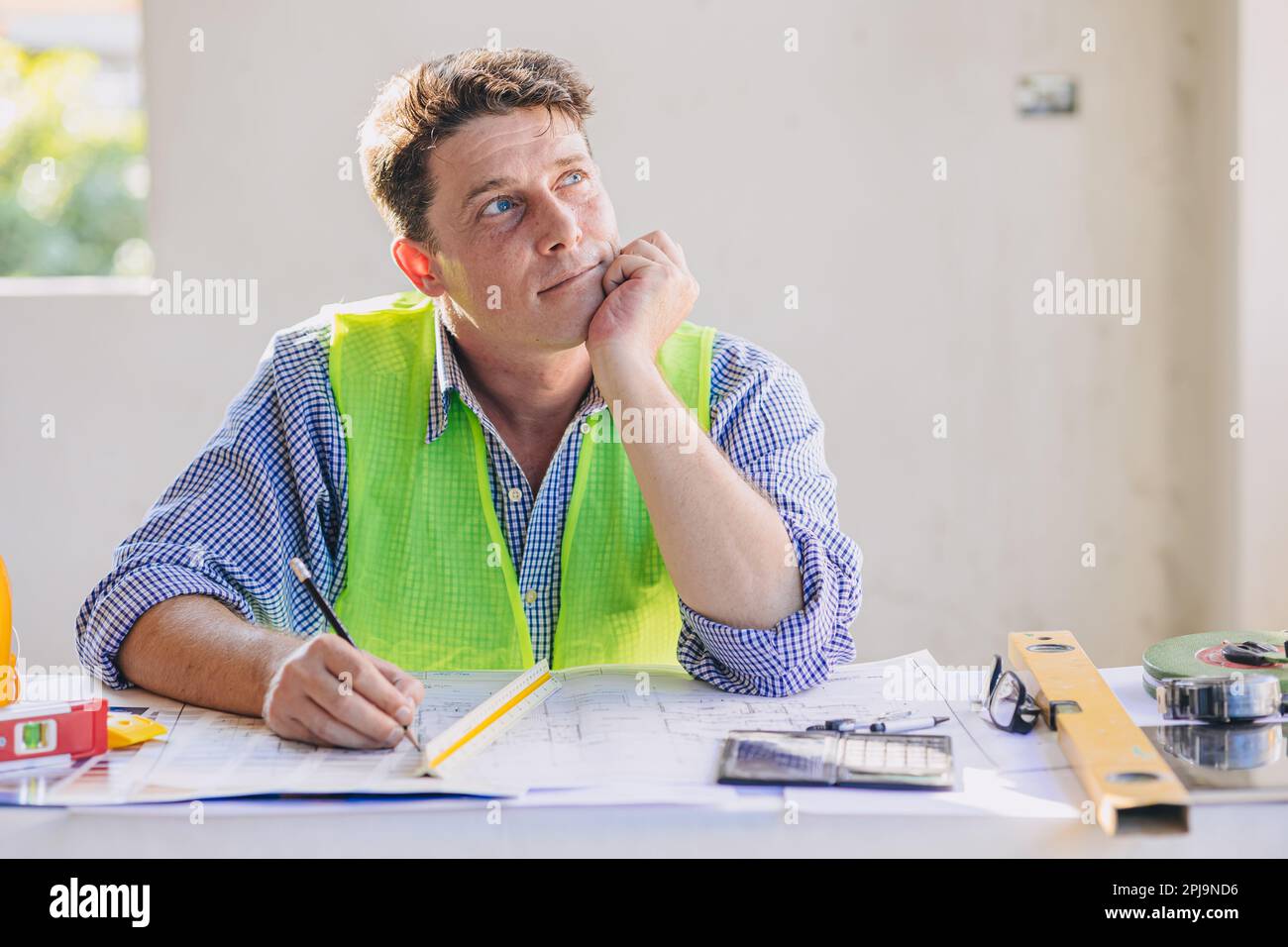 Construction engineer architect working at construction site with ...