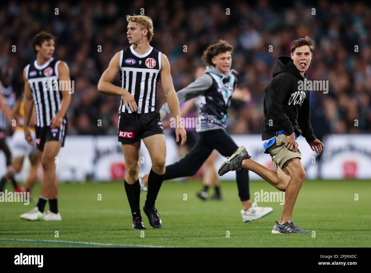 Pitch invaders during the AFL Round 3 match between the Port Adelaide ...