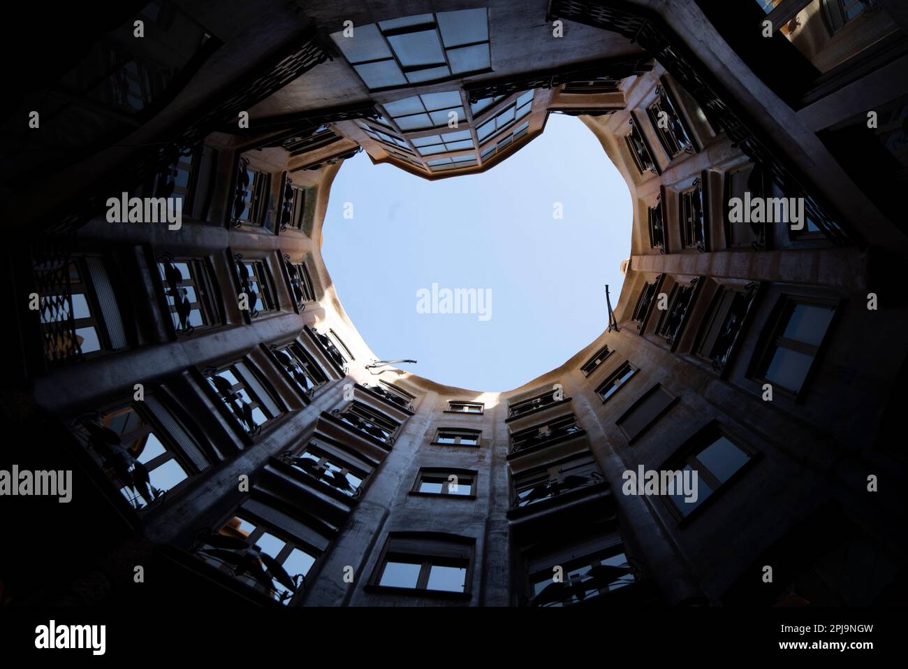 Moon-shaped view looking up from inside one of the courtyards of Casa ...