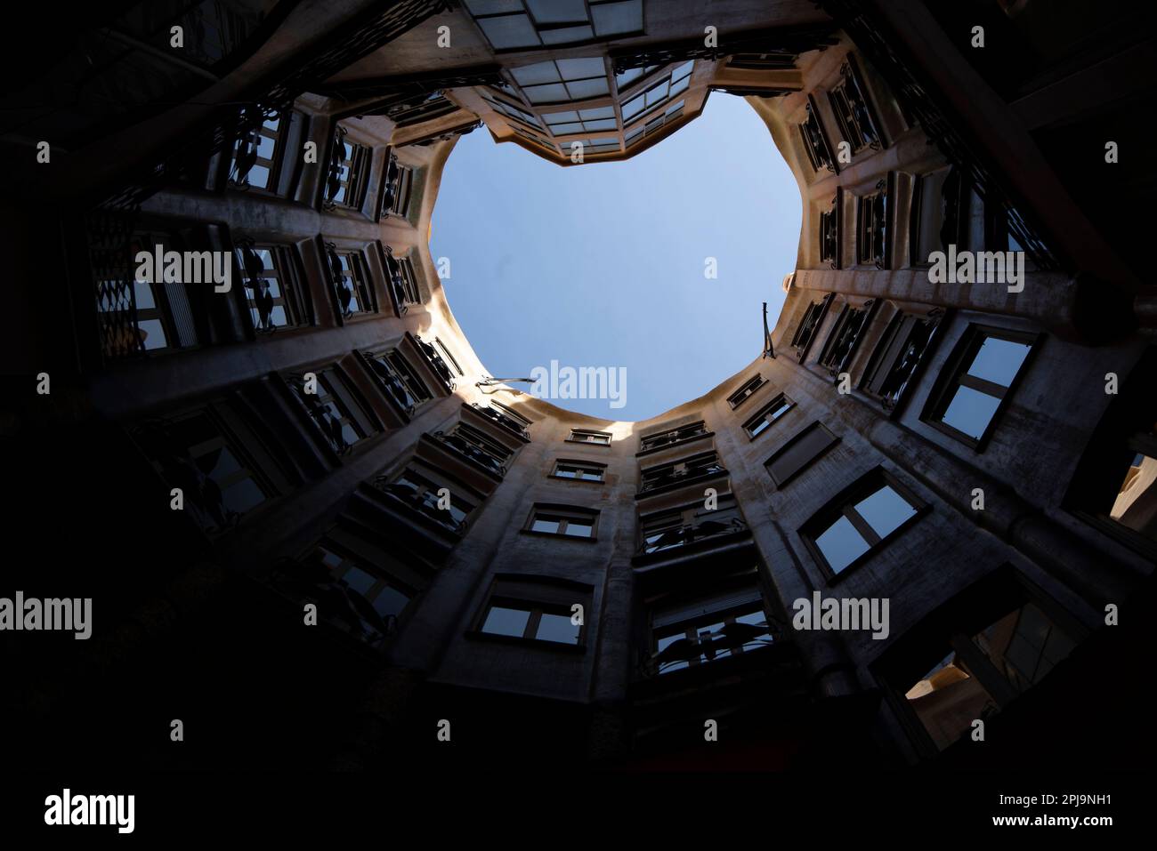 Moon-shaped view looking up from inside one of the courtyards of Casa ...