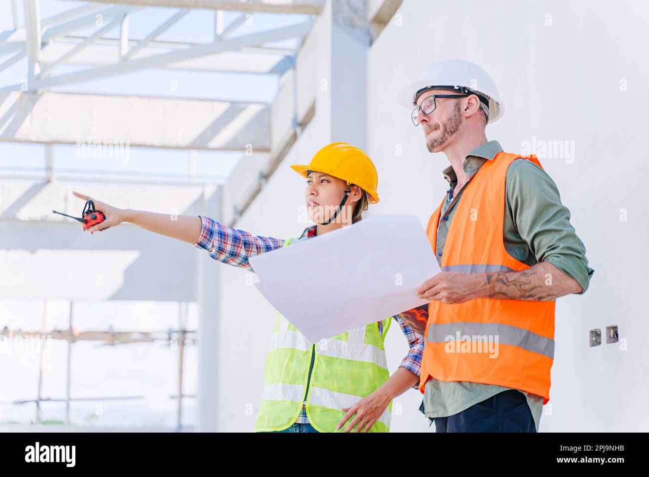 Construction engineer with architect team working check building ...