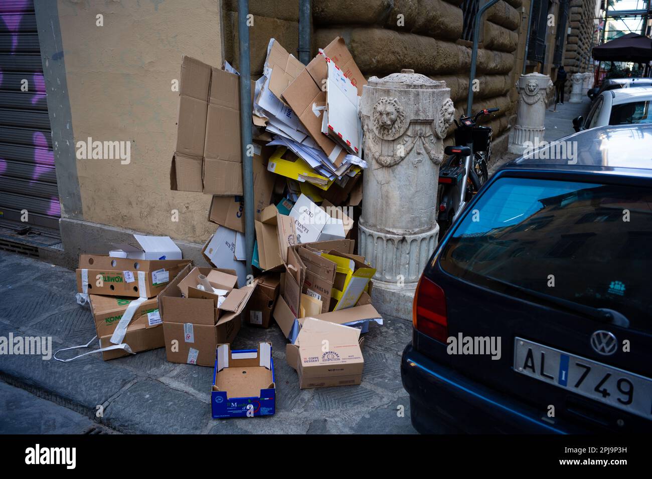 Paper and cardboard piled up on the pavement awaiting collection for ...