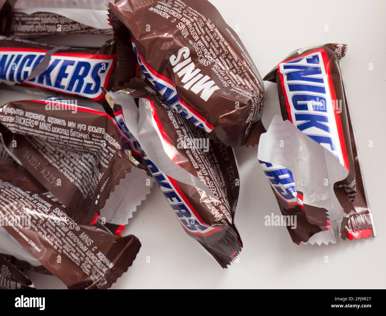 Сhocolate bar Snickers on a brown background Stock Photo - Alamy
