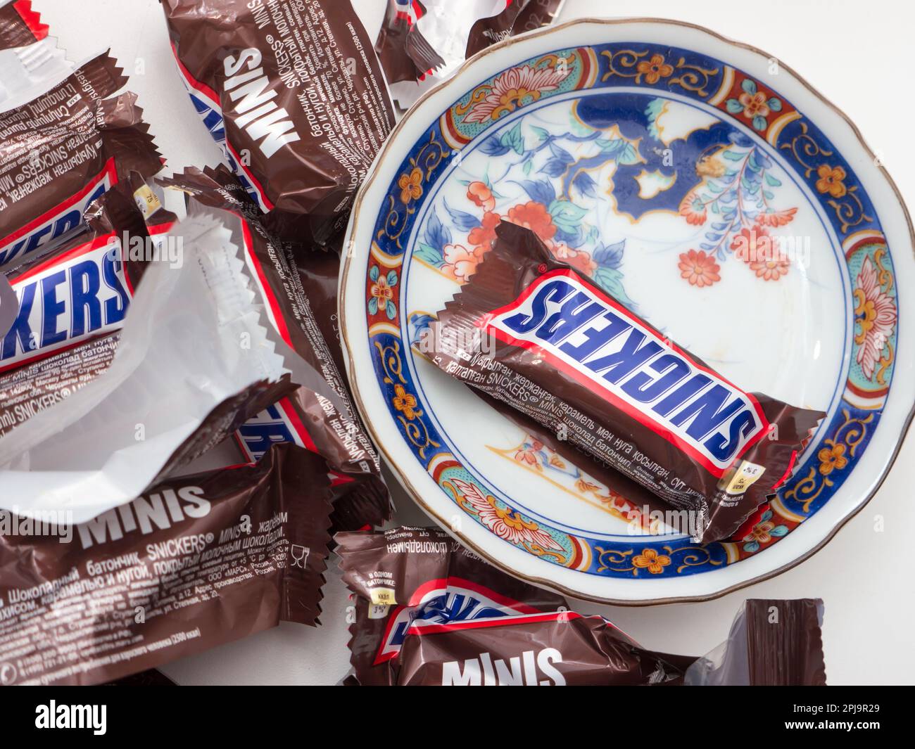 Сhocolate bar Snickers on a brown background Stock Photo - Alamy