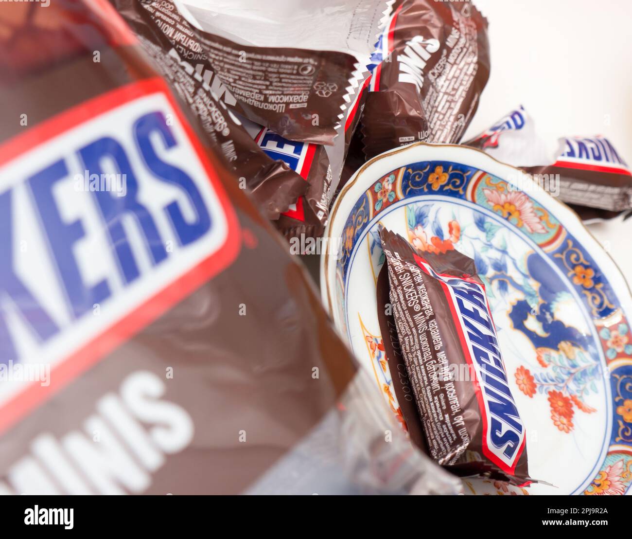 Сhocolate bar Snickers on a brown background Stock Photo - Alamy