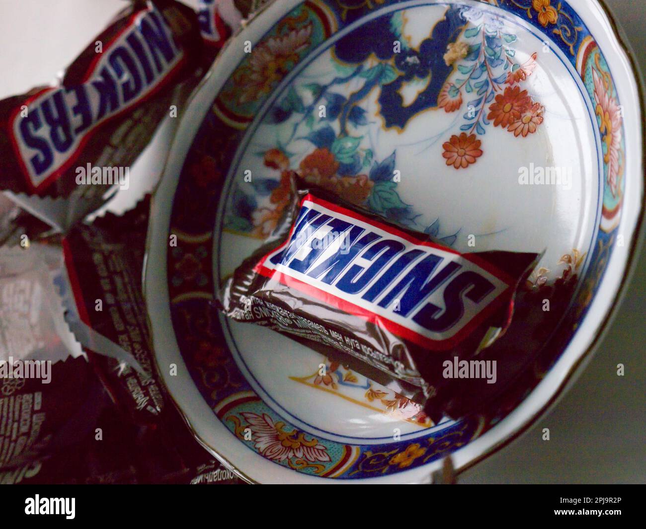 Сhocolate bar Snickers on a brown background Stock Photo - Alamy