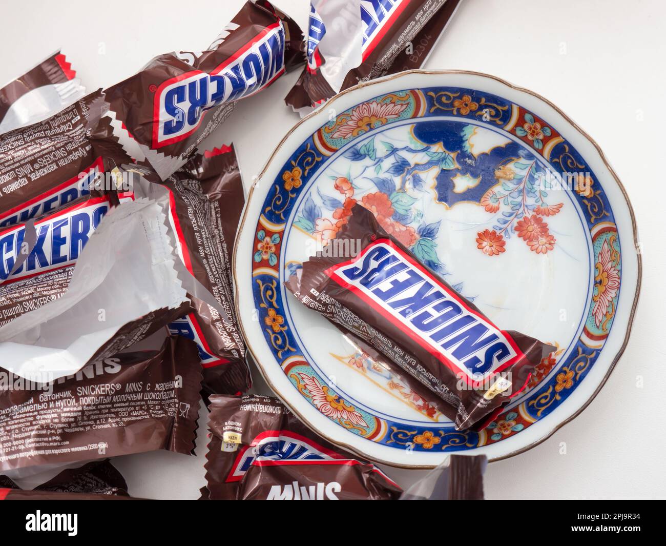 Сhocolate bar Snickers on a brown background Stock Photo - Alamy