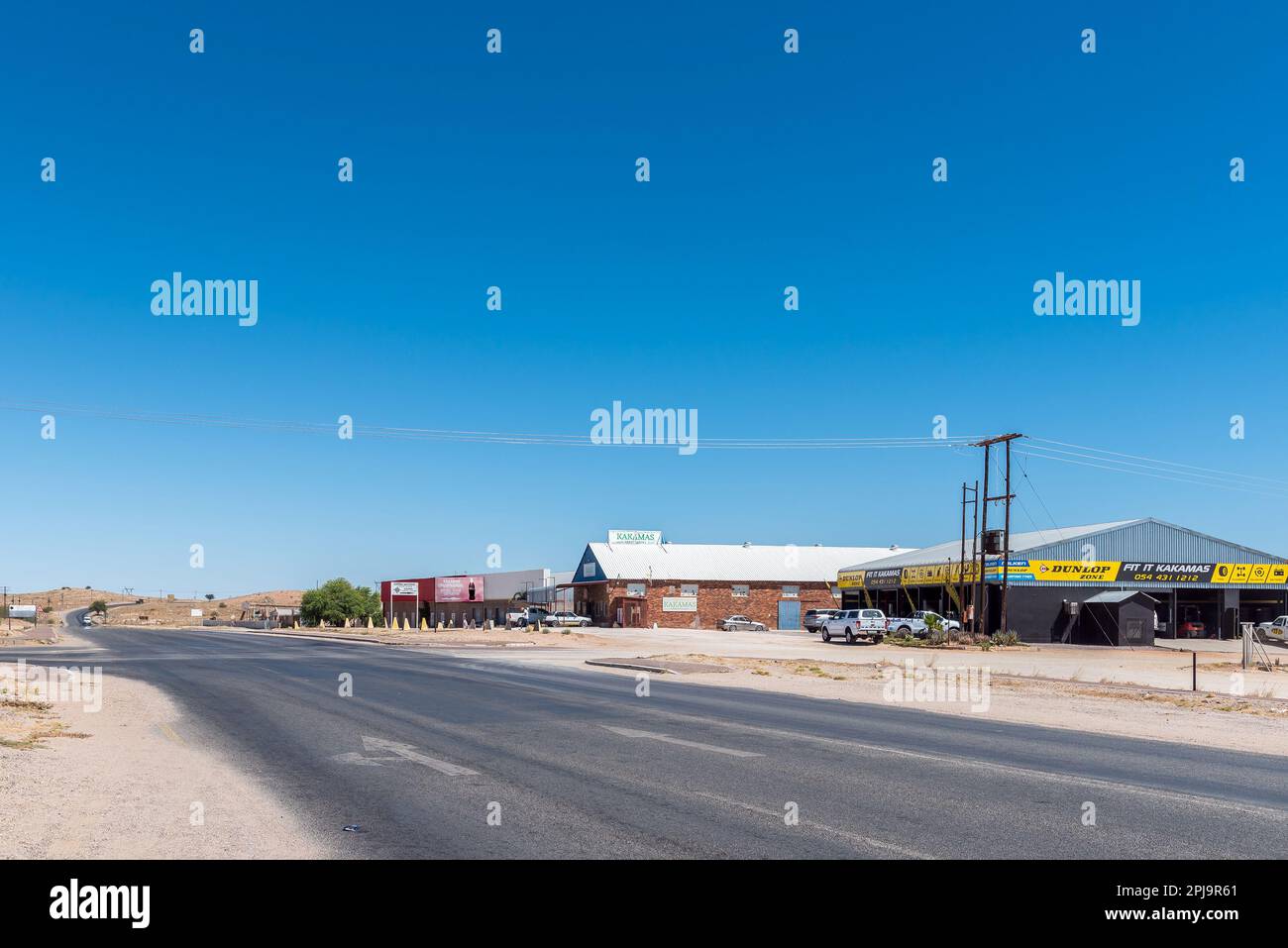 Kakamas, South Africa - Feb 25, 2023: Businesses and vehicles, next to ...