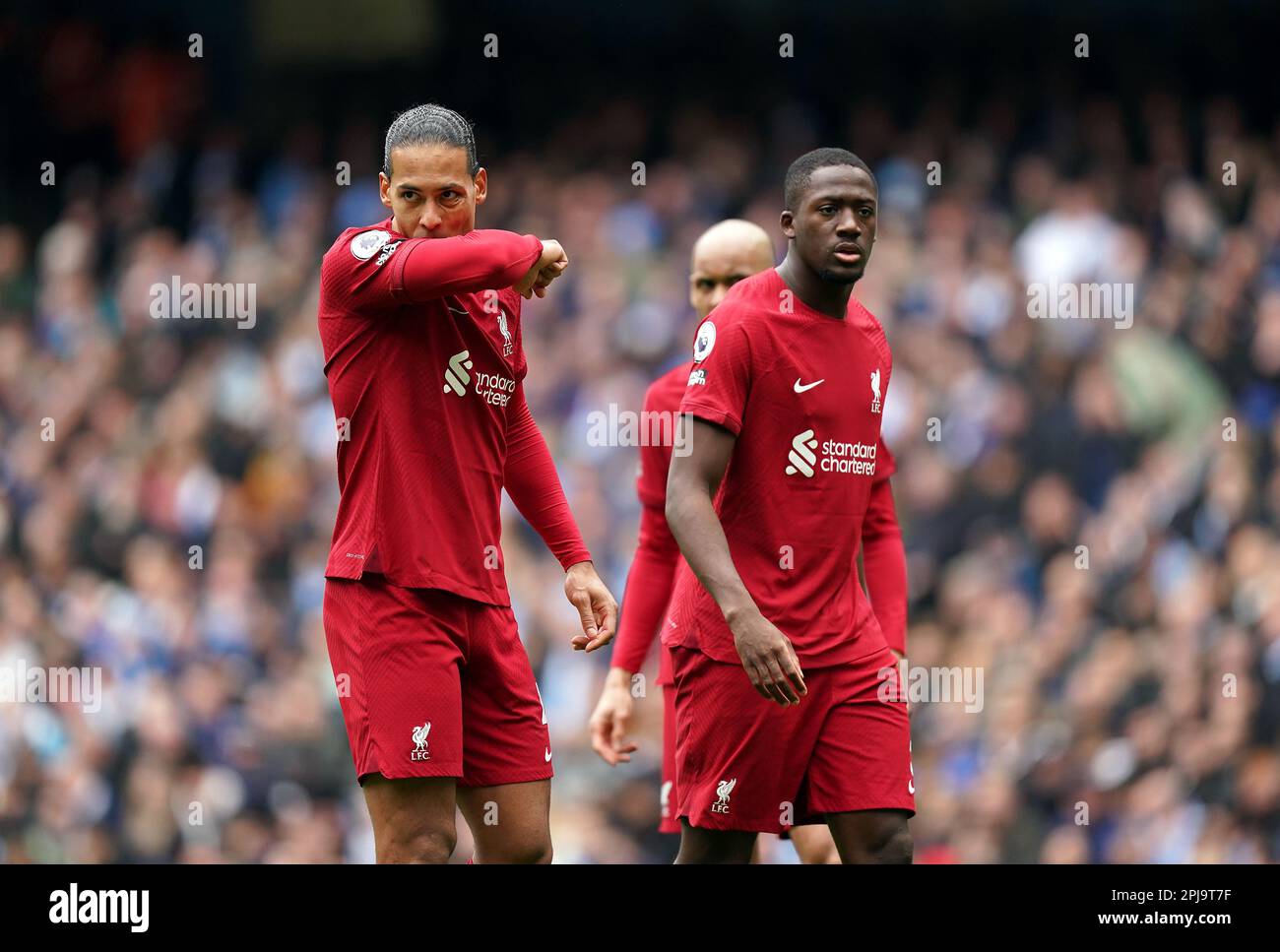 Liverpool's Virgil van Dijk (left) and Ibrahima Konate appear dejected ...