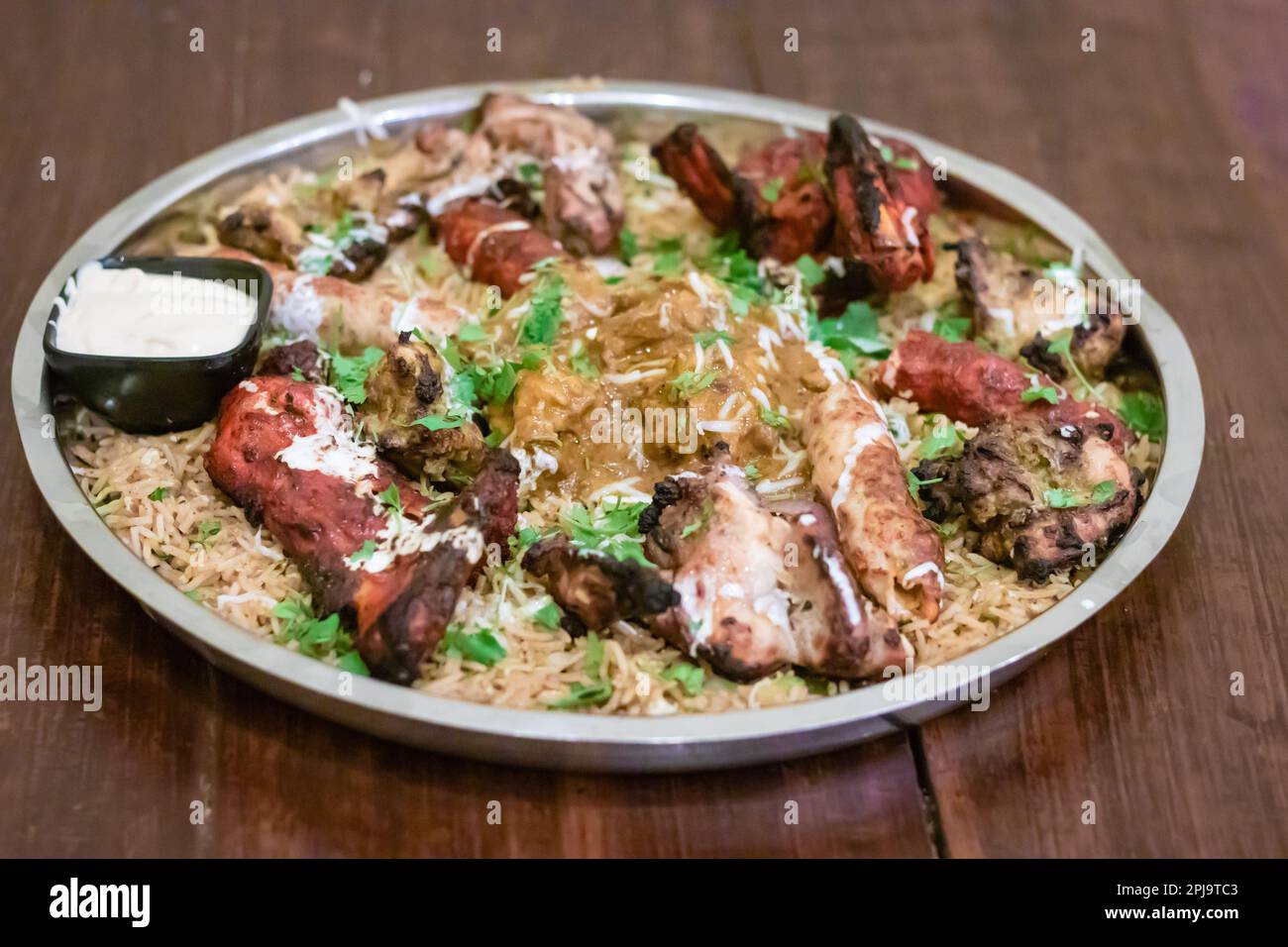 tandoori chicken and kebab served in steel plate at night Stock Photo ...
