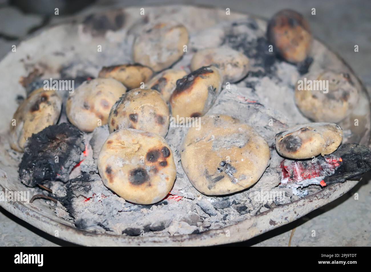 authentic traditional litti at hot cow dunk ashes from flat angle Stock ...
