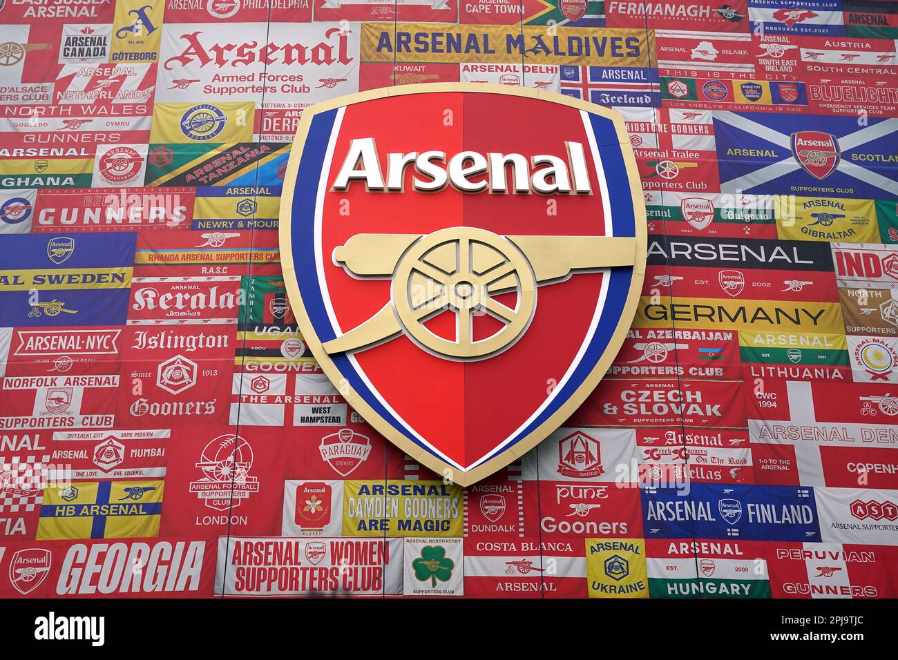 An Arsenal club badge and mural of fan groups on the outside of the ...