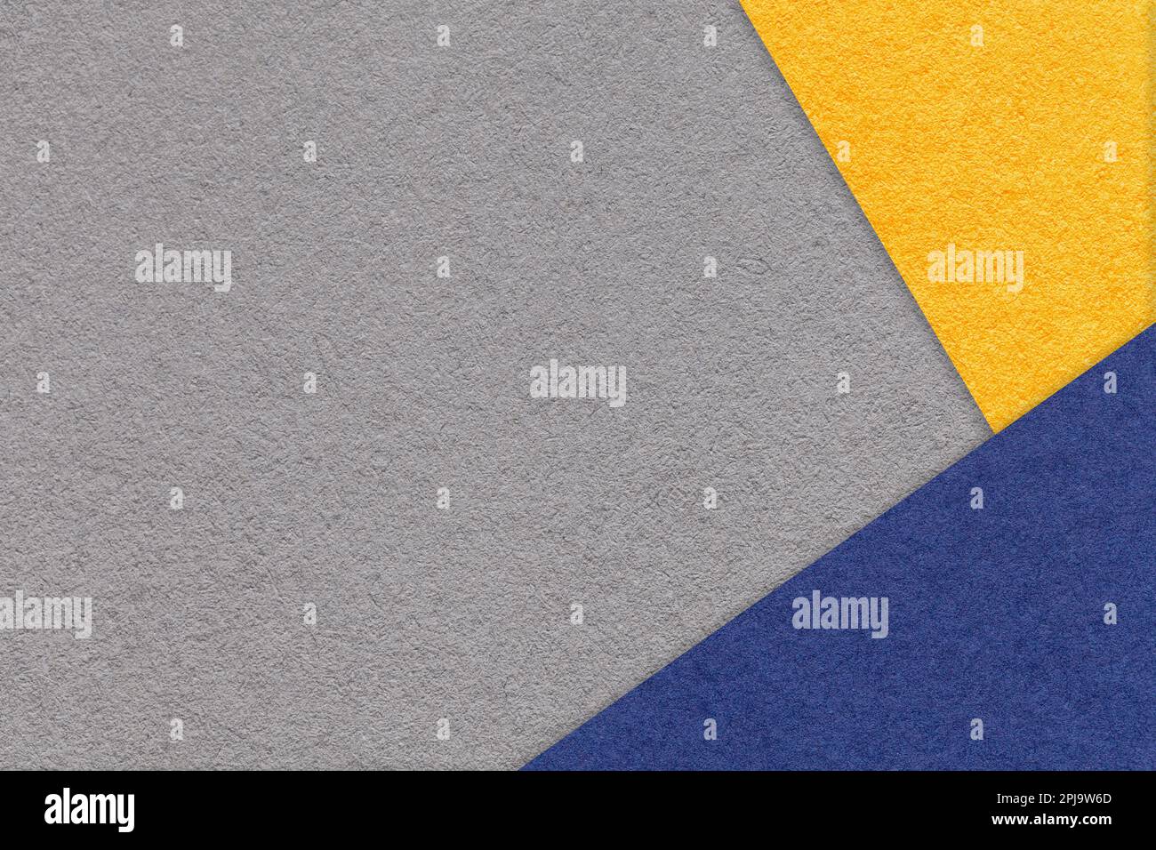 Texture of craft gray color paper background with yellow and navy blue ...