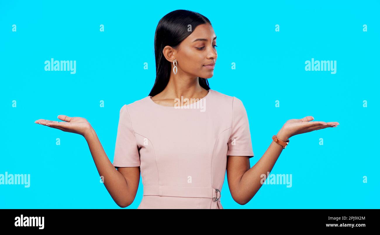 Choice, option or decision and a woman on a blue background in studio ...