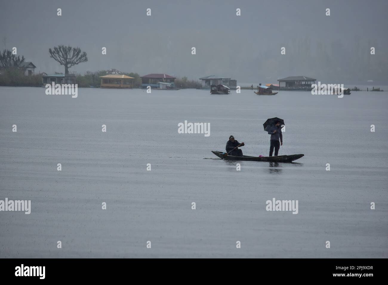 Srinagar, India. 01st Apr, 2023. A boatman ferries a passenger in his ...