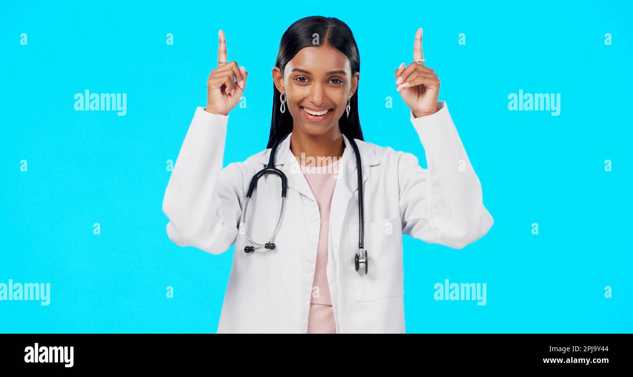 Hospital doctor, studio and happy woman point at medical promotion ...