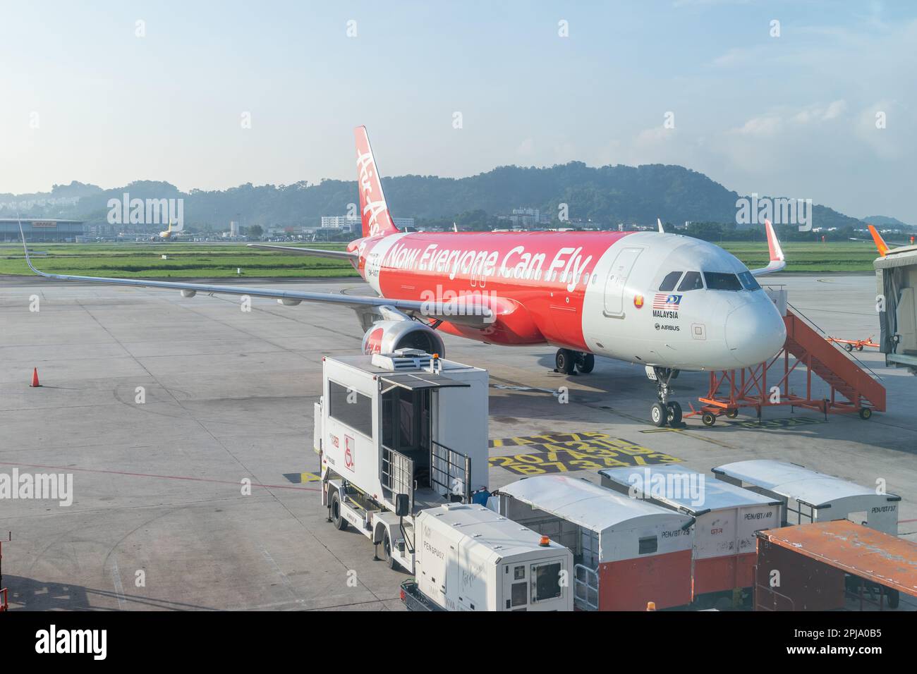 Air Asia aircraft docking at Penang International Airport Stock Photo ...