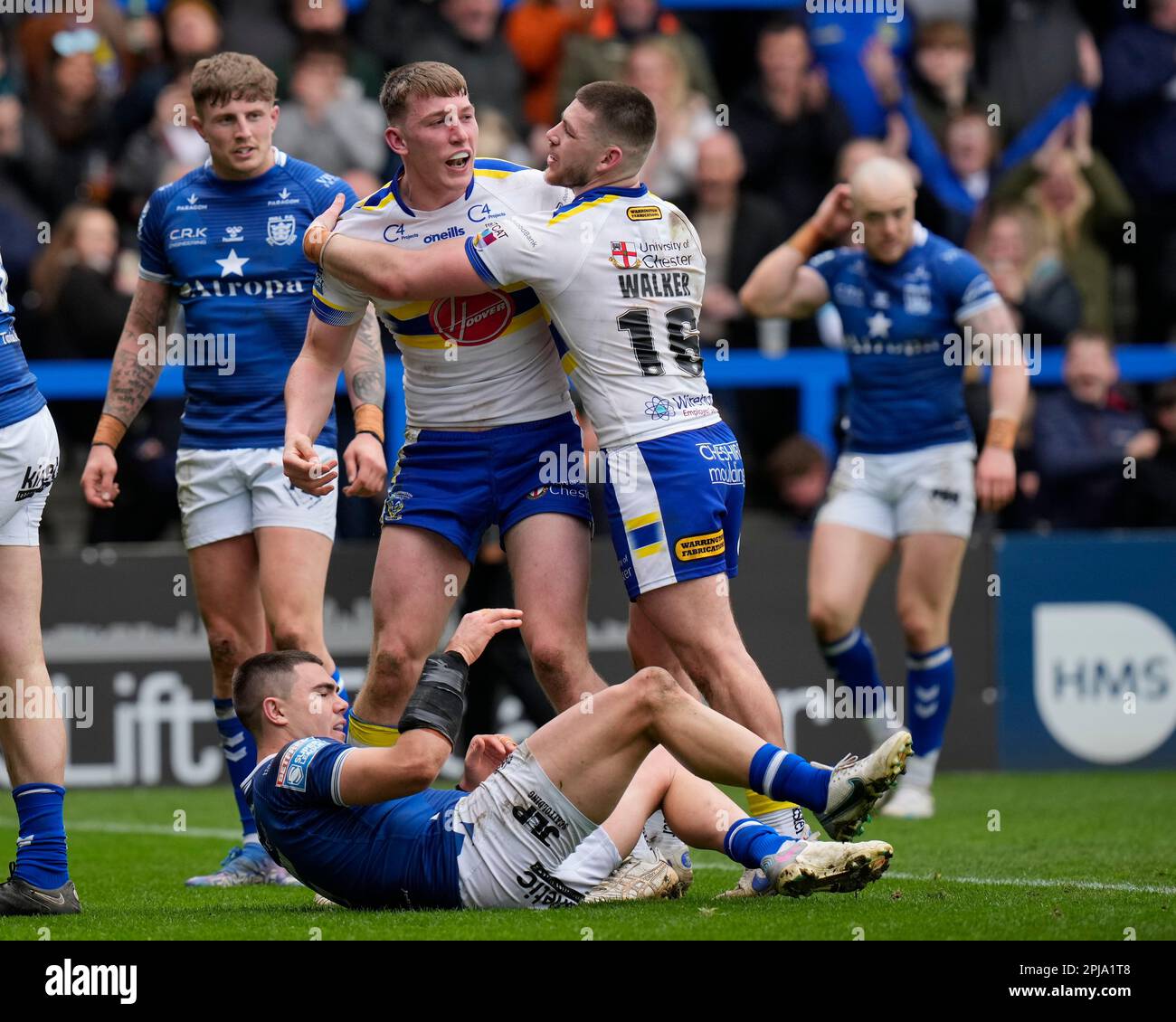 Danny Walker #16 of Warrington Wolves celebrates with try scorer Matty ...