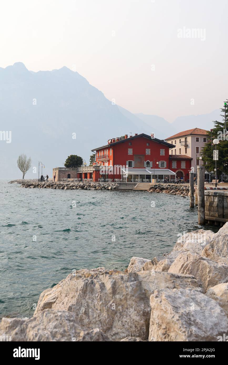 Spring landscape with stone pathway and colorful buildings and ...