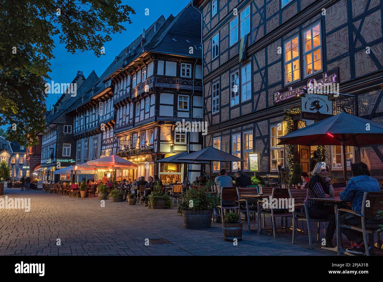 Historic medieval half timbered buildings, bars, shops, people and ...
