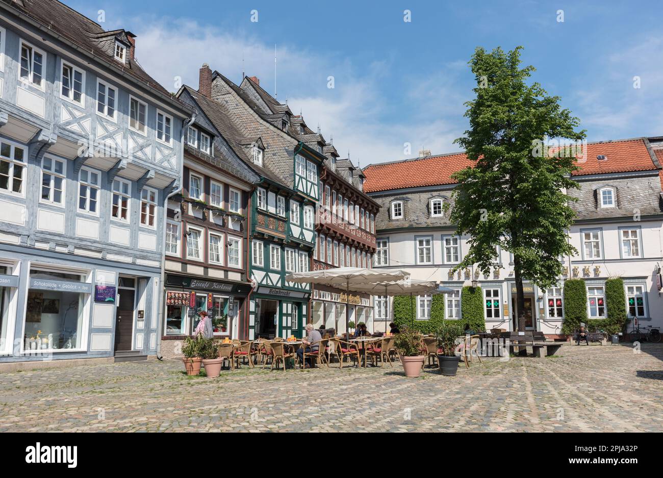 Historic medieval half timbered buildings with shops and cafes in ...