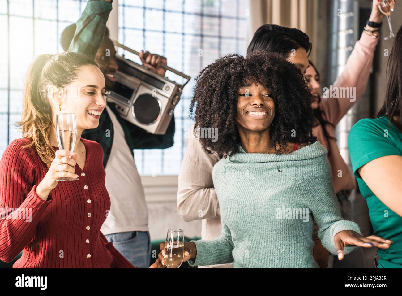 Multi ethnic young friends having home party together - Funny diverse ...