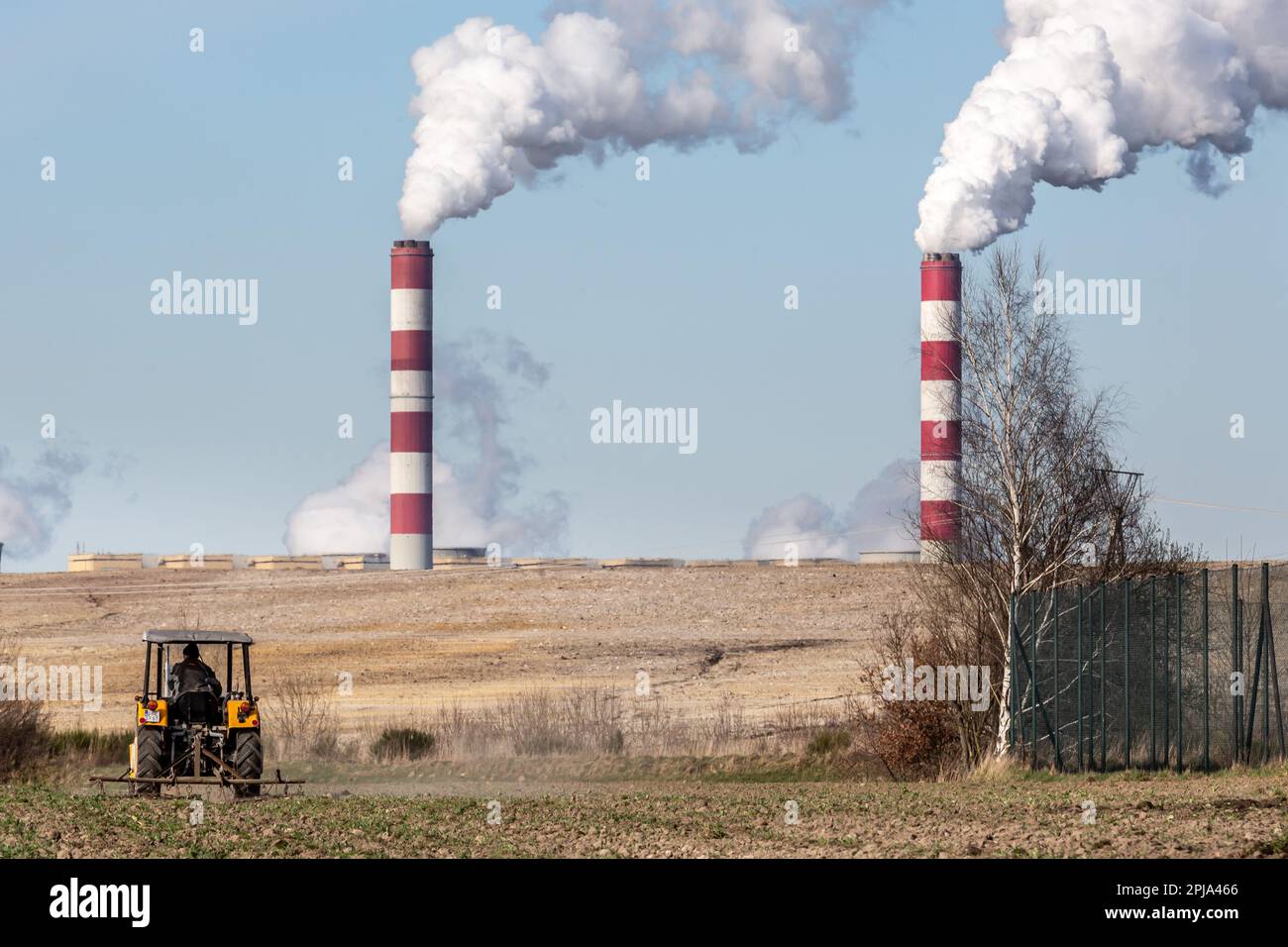 Belchatow, Poland. 01st Apr, 2023. A farmer works on his field in front ...