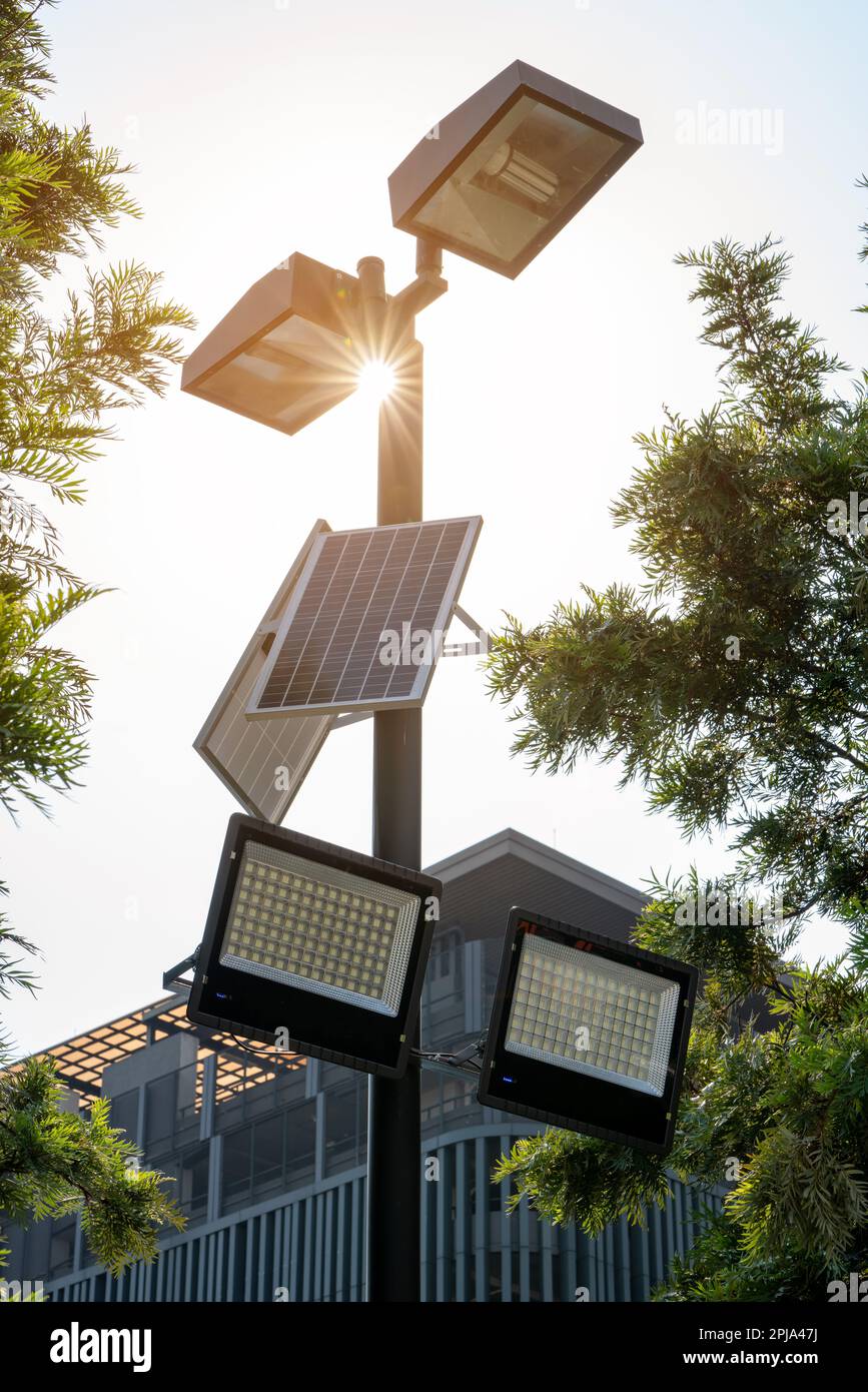 Solar Light. Public city light with solar panel powered on blue sky ...