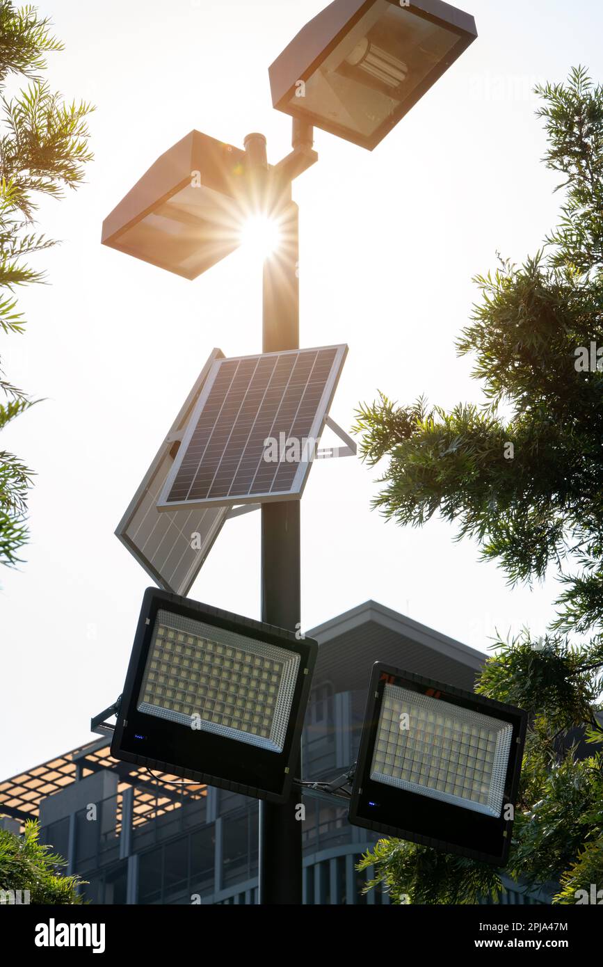 Solar Light. Public city light with solar panel powered on blue sky ...