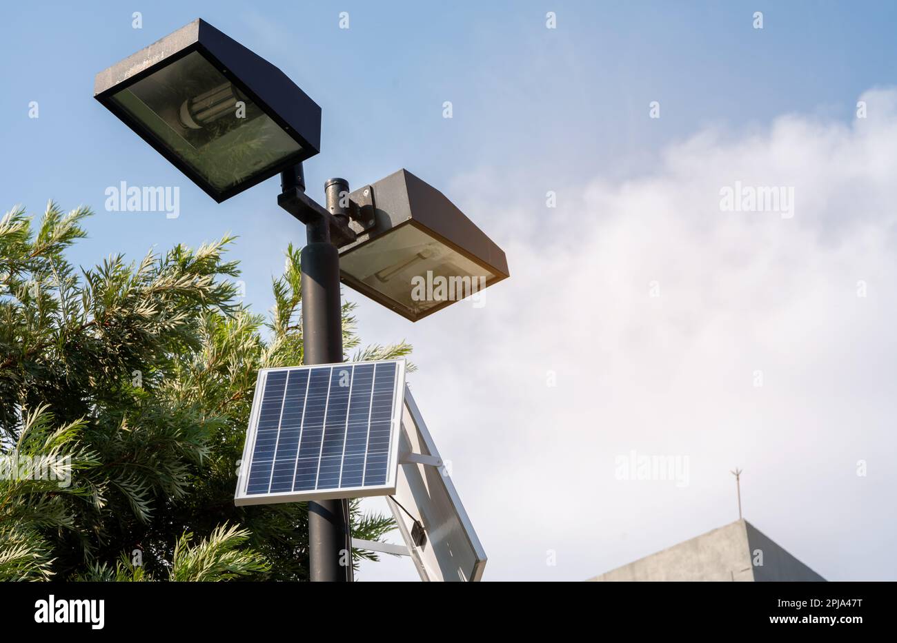 Solar Light. Public city light with solar panel powered on blue sky ...